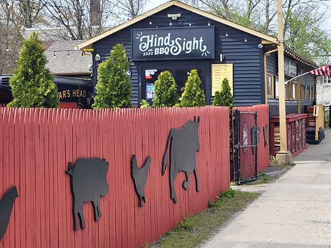 That black building with the cheerful rooster isn't hiding its secrets well—smoke signals give it away every time.