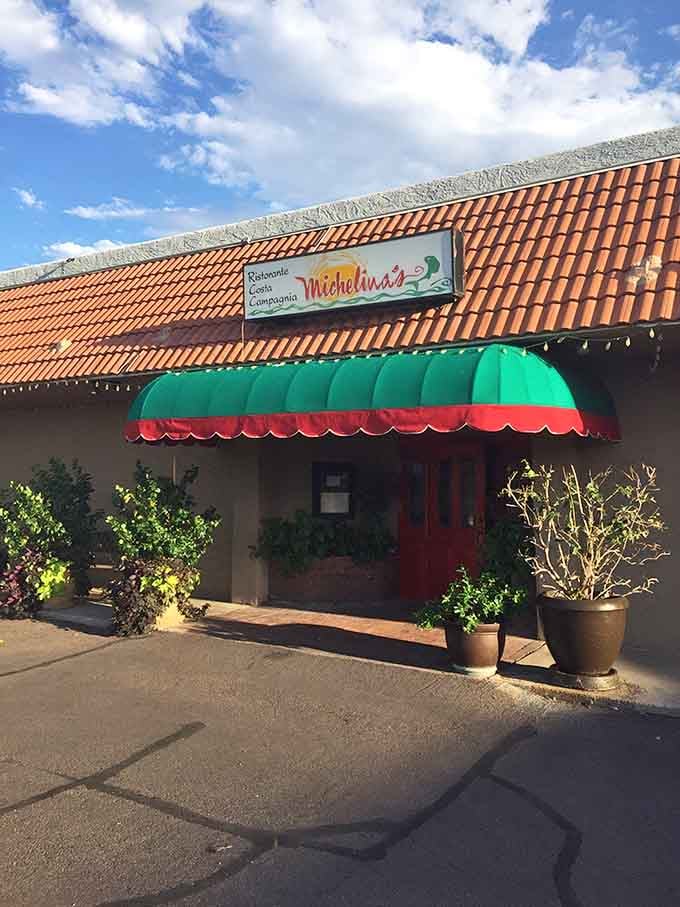 The potted plants flanking the entrance promise the kind of care that extends to every plate inside.
