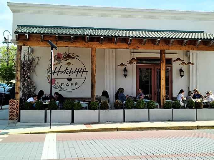 That white facade with a wooden door isn&rsquo;t just an entrance, it&rsquo;s your gateway to brunch paradise.