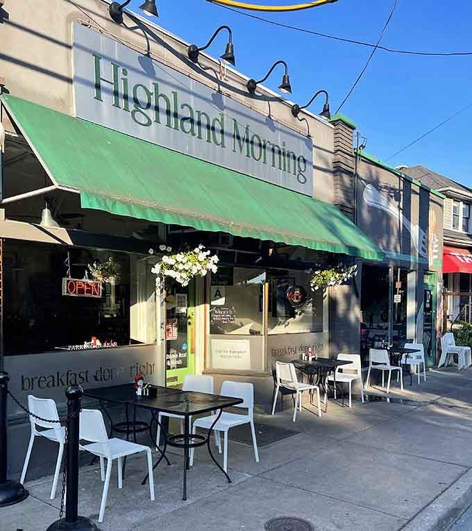 That green awning beckons like a lighthouse for the breakfast-obsessed, promising fluffy eggs and strong coffee within.