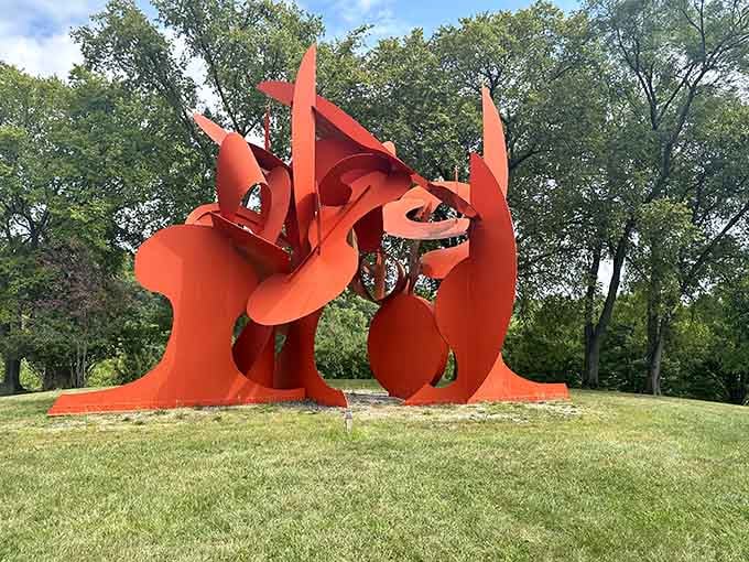 This blazing orange sculpture looks like abstract art had a baby with a dragon and nobody's complaining.