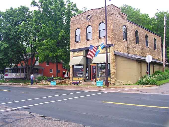 Historic buildings with character that modern architecture forgot how to create, flying flags with small-town pride.