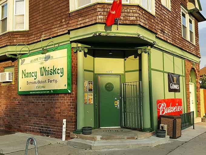 That green corner entrance has welcomed thirsty souls since 1902, proving some doors never close on good times.
