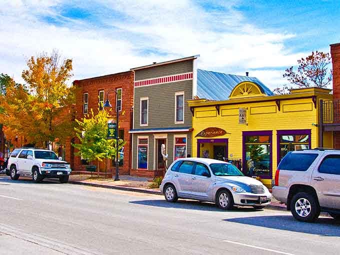 That yellow storefront pops like a sunflower in a field of historic brick and autumn leaves.