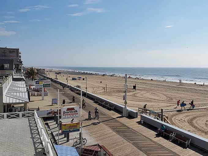 The boardwalk stretches like a wooden ribbon along the shore, inviting endless strolls and spontaneous adventures.