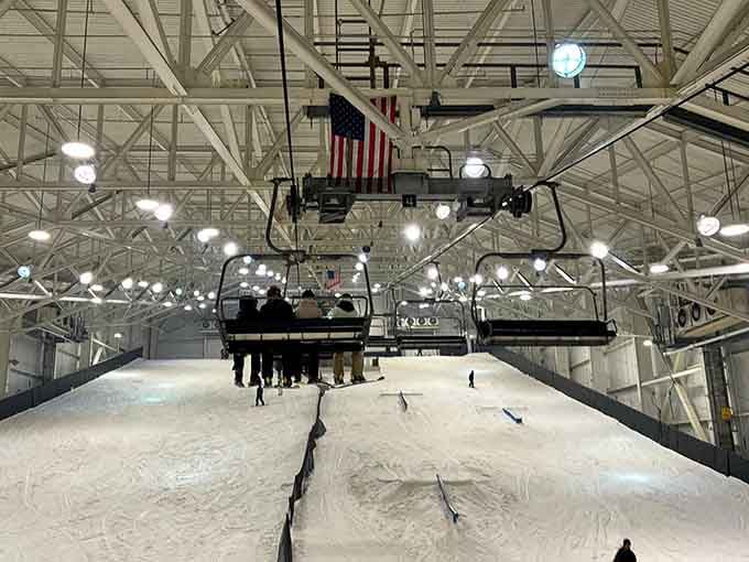 That's an American flag hanging over an indoor ski slope in New Jersey, because sometimes patriotism means building mountains where nature forgot.