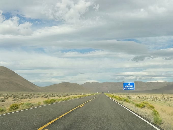 The open road stretches endlessly ahead, promising adventure in every mile of this stunning high desert landscape.