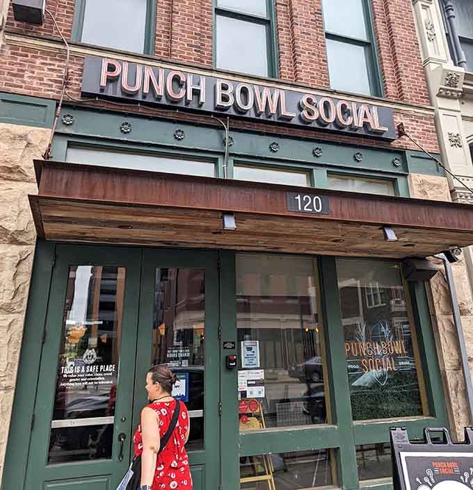 That unassuming storefront at 120 holds more fun than you'd guess from its modest exterior appearance.