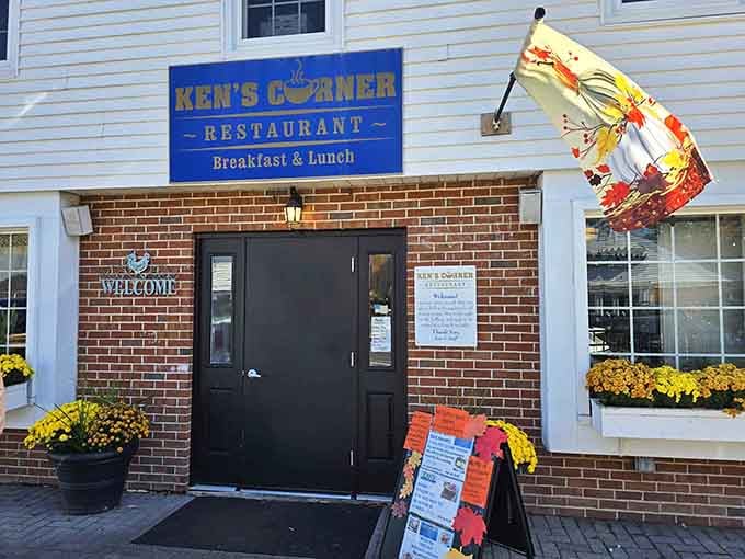 That cheerful coffee cup sign hanging outside is basically waving you in for breakfast like an old friend.