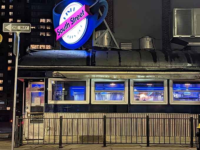 That glowing neon sign cutting through the Boston night is basically a homing beacon for hungry souls citywide.