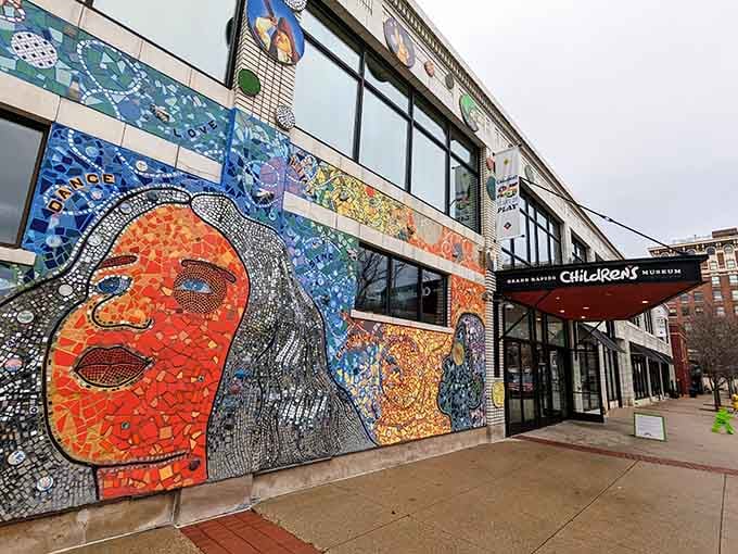The colorful mosaic facade practically shouts "creativity lives here" louder than your kids on a sugar high.