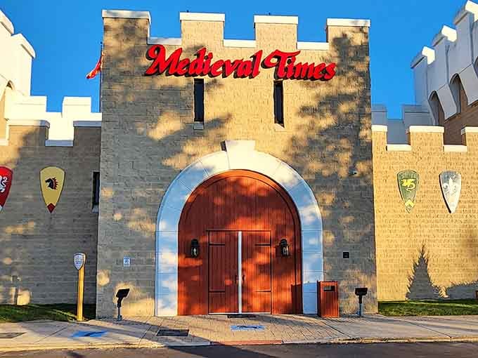 The grand entrance glowing looks like someone dropped a Spanish castle into an Illinois parking lot.