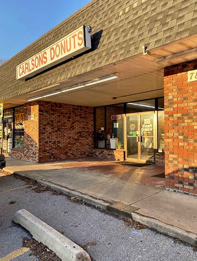 That classic brick exterior and simple signage tell you everything: this is a donut shop that lets its pastries do the talking.