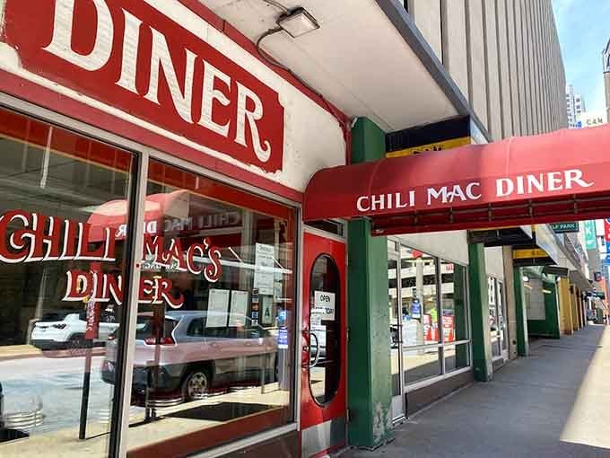 That bold red awning and vintage signage practically shout "real diner ahead," and they're not lying one bit.
