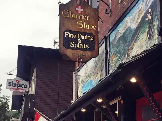 That hand-carved sign hanging above the entrance isn't just decoration; it's a promise of Alpine authenticity waiting inside.