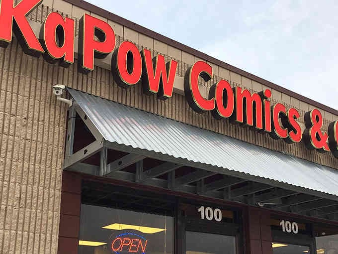 That bold red signage isn't just announcing a comic shop&mdash;it's declaring a revolution in caffeine and capes.