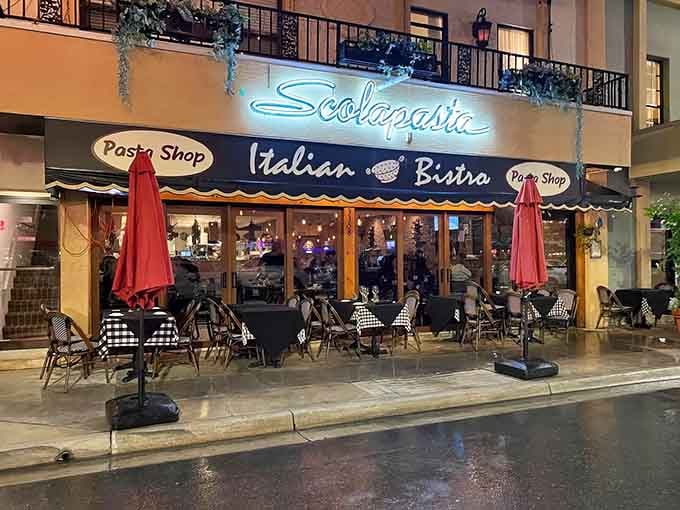 That glowing Scolapasta sign beckons like a lighthouse guiding hungry sailors to fresh pasta shores and Italian bliss.