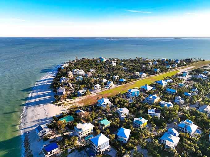 An aerial view reveals colorful beach houses scattered like confetti across this car-free paradise in the Gulf.
