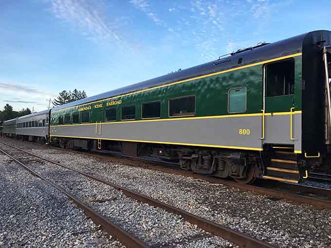 The Adirondack Railroad's vintage coaches waiting at the platform, ready to whisk you into upstate New York's wilderness.