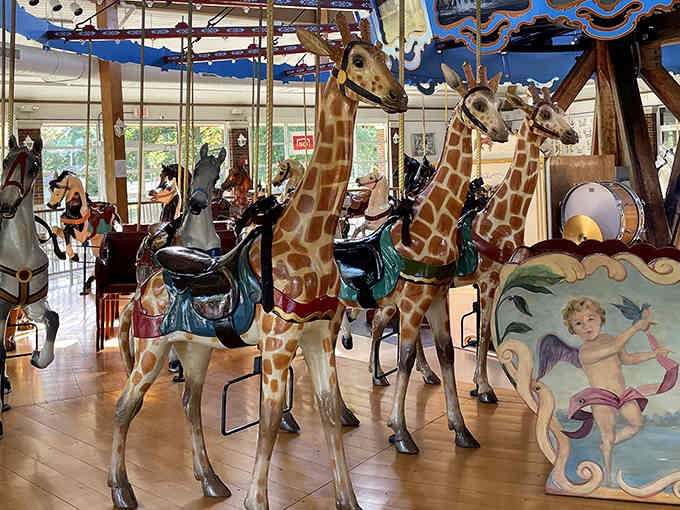 Hand-carved wooden horses frozen mid-gallop, each one a masterpiece that puts modern amusement parks to shame.