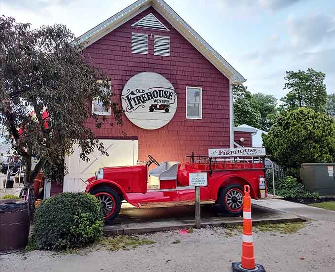 The red barn exterior promises wine, history, and zero pretension inside those welcoming doors.