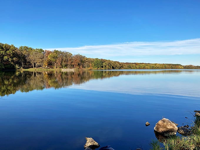 When the lake mirrors the sky this perfectly, you start questioning which way is up&mdash;nature's optical illusion at its finest.