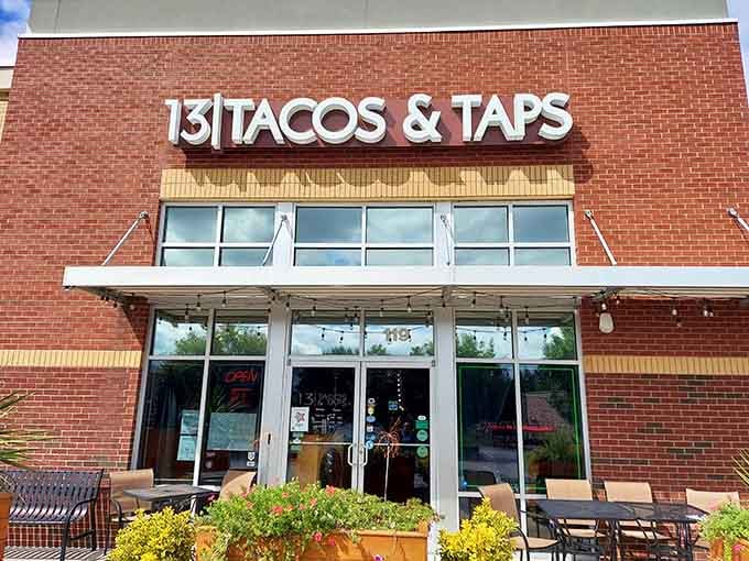 Clean lines and brick facade signal serious food happening behind that glass, not just another strip mall disappointment.