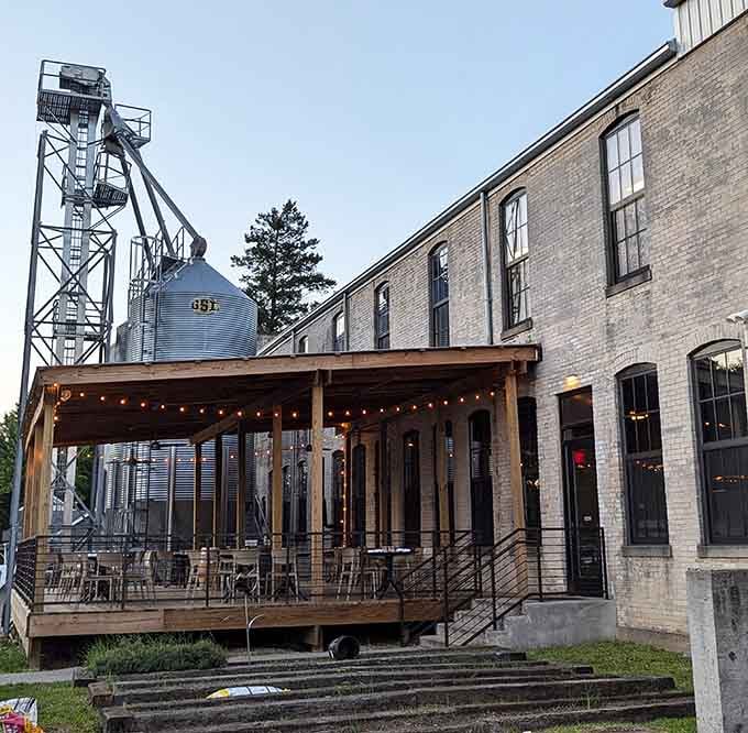 That grain silo and outdoor deck combo says "we're serious about spirits but also about good times."