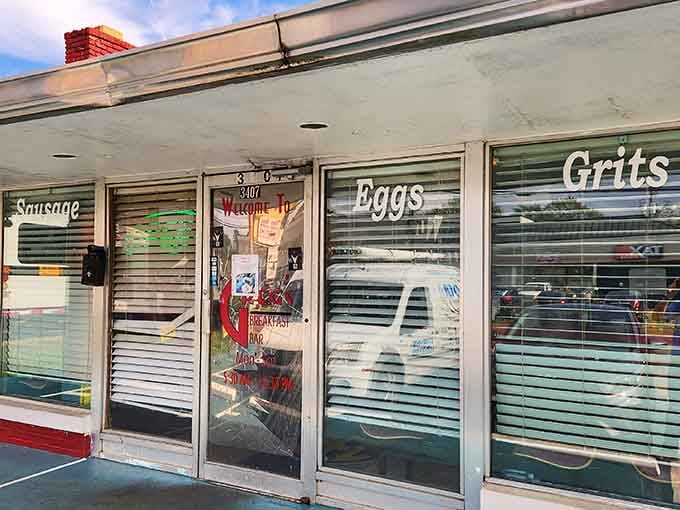 That classic diner storefront promises serious breakfast inside, and those window signs don't lie about what's cooking.