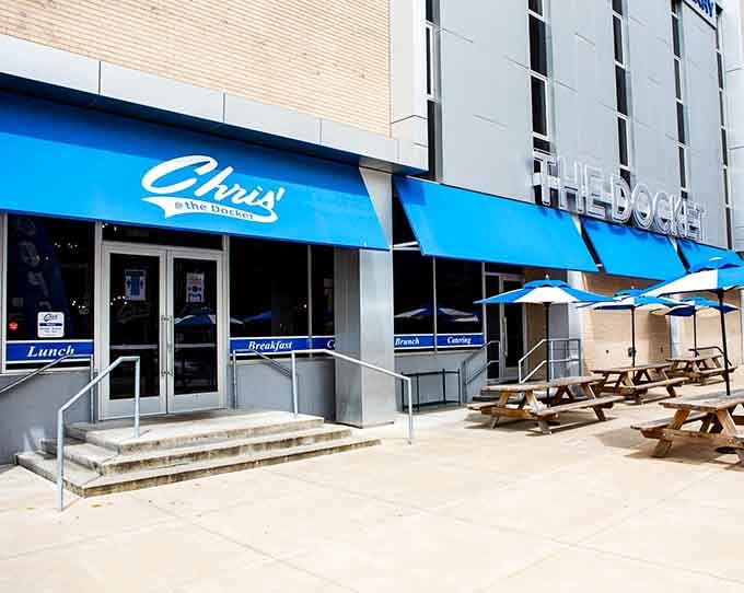 That electric blue awning practically glows like a neon diner sign from the golden age of breakfast.