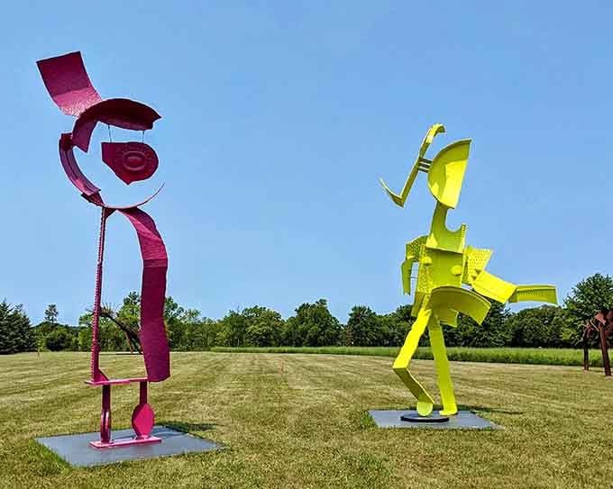 Two towering metal figures face off like they're about to settle an argument through interpretive dance.