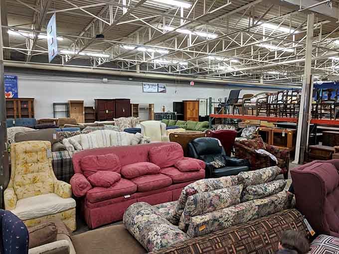 A sea of couches stretching toward the horizon, each one waiting to become someone's favorite spot for Sunday football.