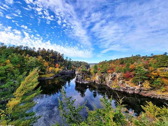 Nature's architecture at its finest, where billion-year-old basalt meets autumn's paintbrush in perfect harmony.