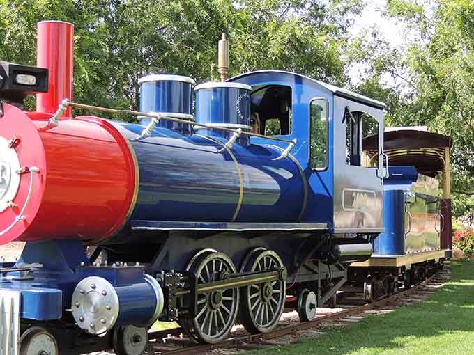 The train cars stretch out like a promise of simple pleasures, waiting to carry you through desert scenery at the perfect pace.