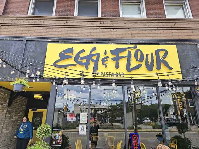 That bold yellow sign against brick isn't just decoration, it's a beacon calling pasta lovers to their happy place.