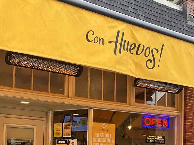 That cheerful yellow awning isn't just decoration, it's a beacon guiding you toward breakfast bliss.