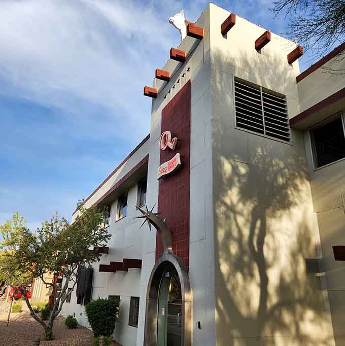 That Southwestern architecture tells you serious beef business happens here, and those shadows dancing across the facade are just the opening act.