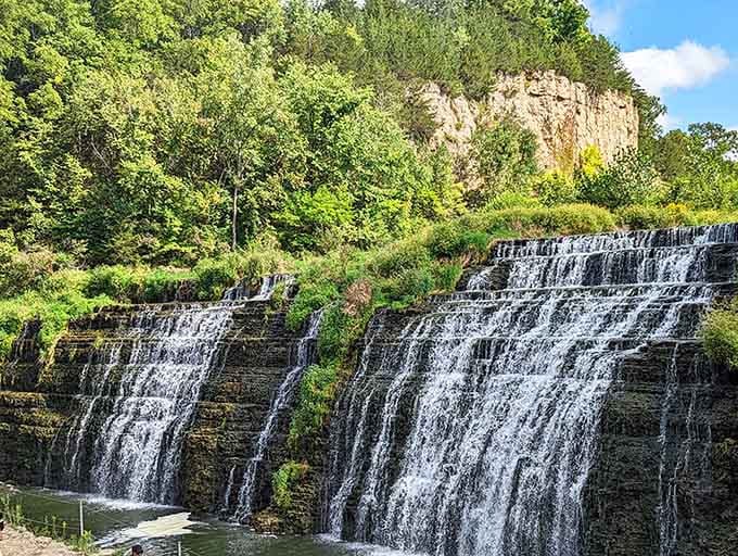 Nature's own multi-tiered masterpiece cascading over ancient limestone like liquid silver in the Illinois sunshine.