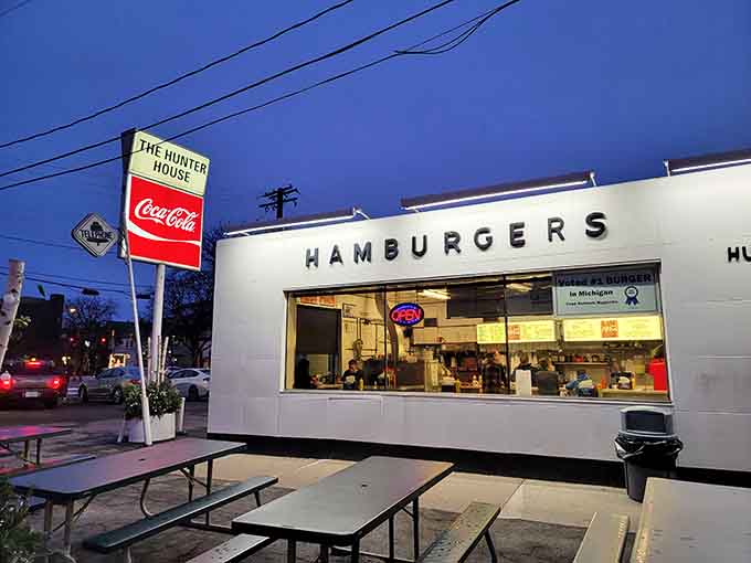 That gleaming white exterior isn't trying to impress anyone, just quietly serving burger perfection since forever.