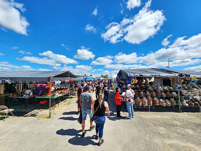 Rows of vendor tents stretch beneath blue skies, promising treasures around every corner at this beloved weekend destination.
