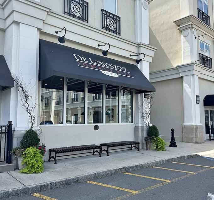 That elegant awning isn't hiding a boutique, it's sheltering some of New Jersey's finest tomato pies waiting inside.