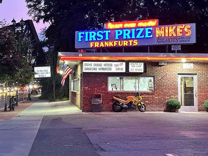 That neon glow isn't just a sign, it's a beacon calling you home to hot dog heaven.