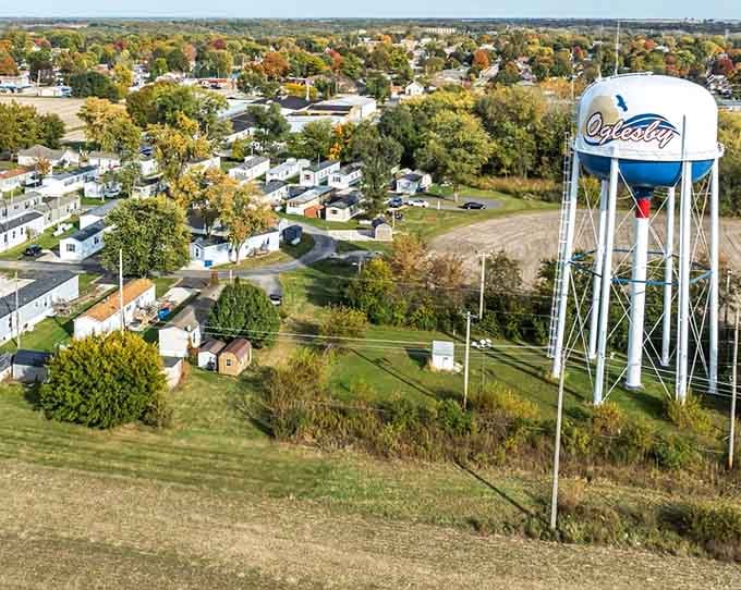 That iconic water tower stands proud over autumn colors, marking your gateway to canyon adventures and river valleys.