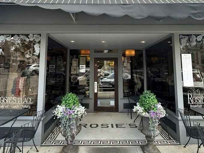 Fresh flowers flanking the entrance like welcoming committee members who actually want you there, imagine that.
