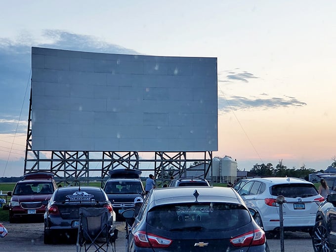 This view reveals the magic: cars gathered under open skies for timeless summer entertainment in Warren.