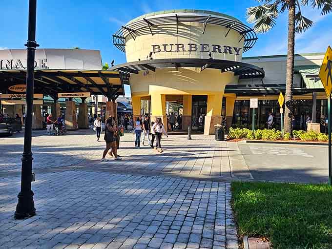 That iconic Burberry entrance stands like a beacon for bargain hunters who appreciate British luxury without the British prices.