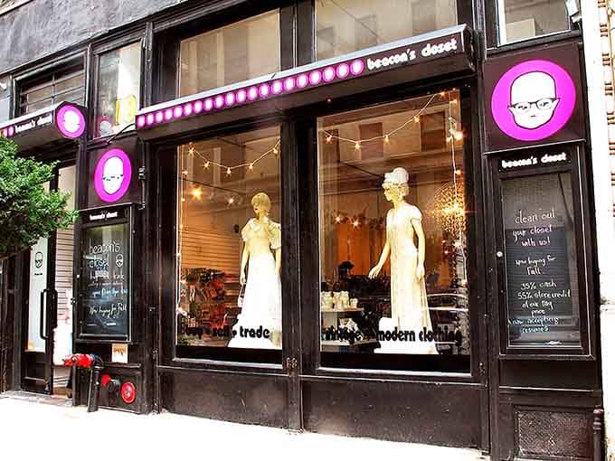 Those window mannequins in vintage white dresses look classier than most wedding guests, proving secondhand can mean first-class style.