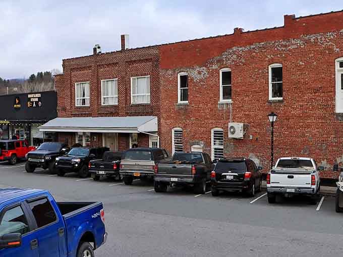 Classic brick storefronts line streets where parking spots outnumber traffic jams, a refreshing mountain town reality.