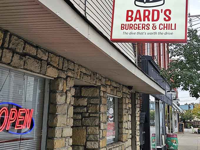 The stone facade and neon glow promise serious burger business inside this Covington cornerstone of culinary ambition.