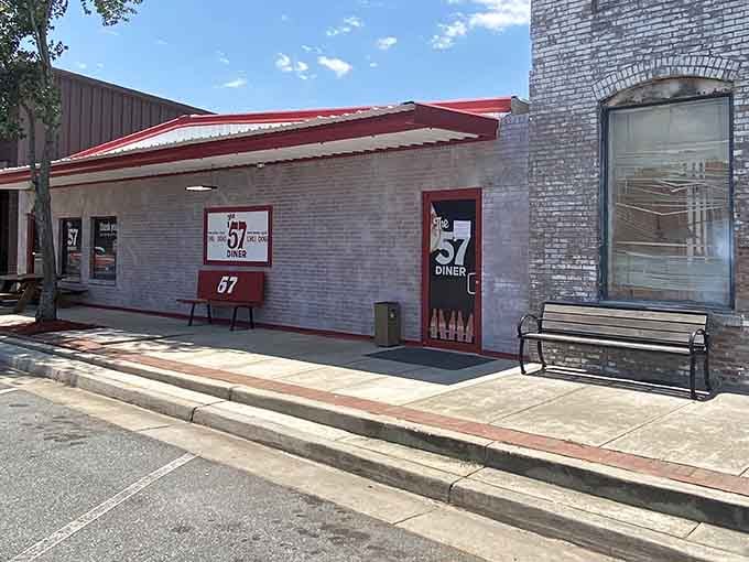 That red and white exterior isn't just charming&mdash;it's a beacon calling hungry travelers to authentic diner bliss.